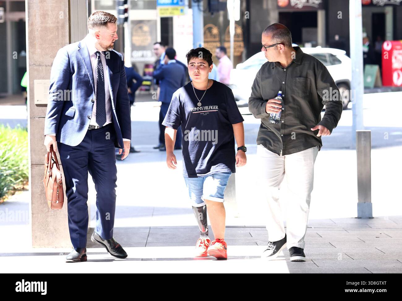 Nicholas Tadros (C) arrives with father Simon (Right) for the Coroners ...