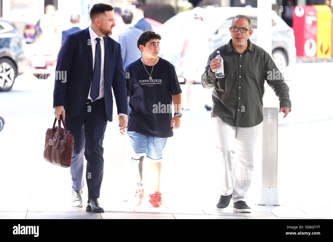 Nicholas Tadros (C) arrives with father Simon (Right) for the Coroners ...