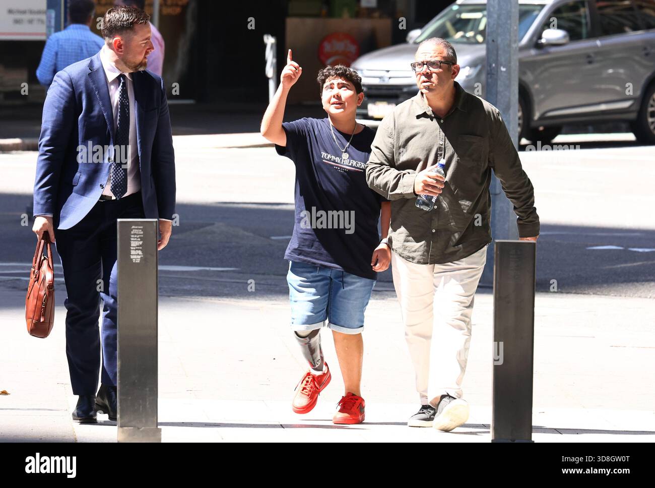 Nicholas Tadros (C) arrives with father Simon (Right) for the Coroners ...