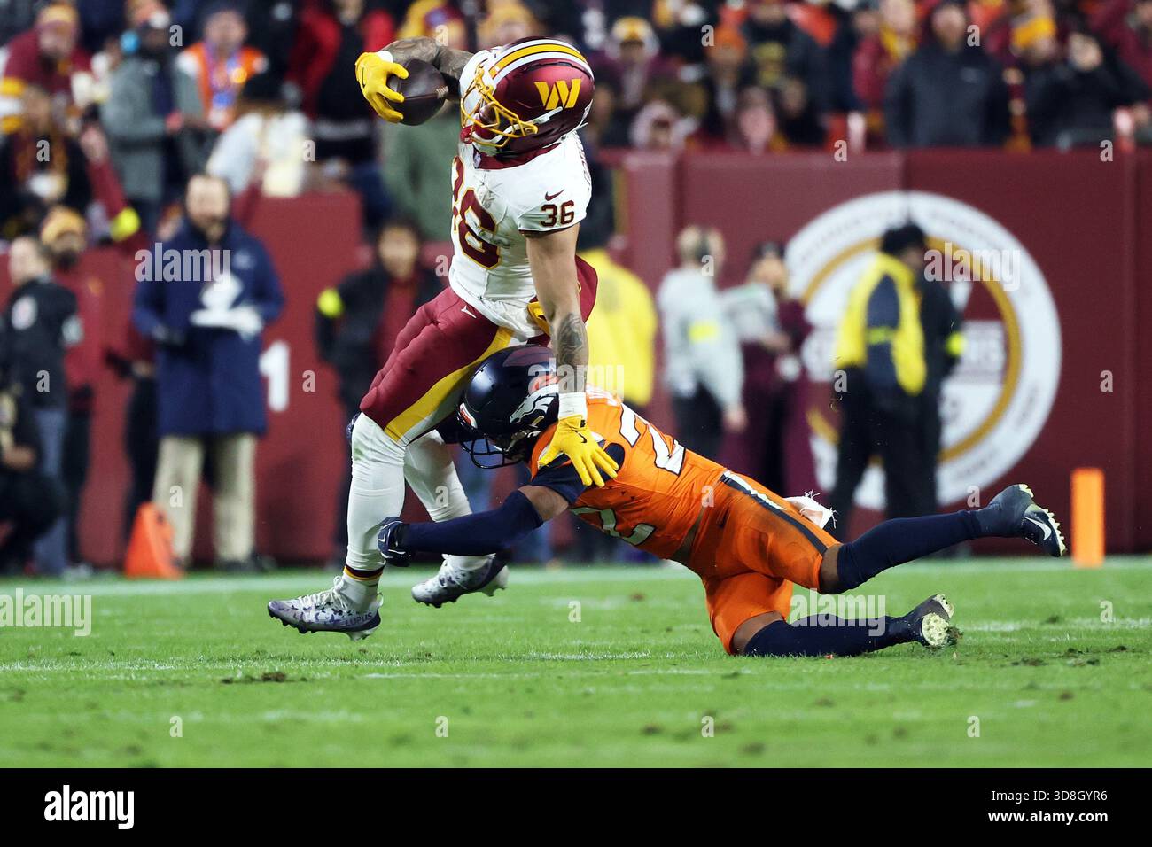 Washington Commanders running back Chris Rodriguez Jr. (36) runs with ...