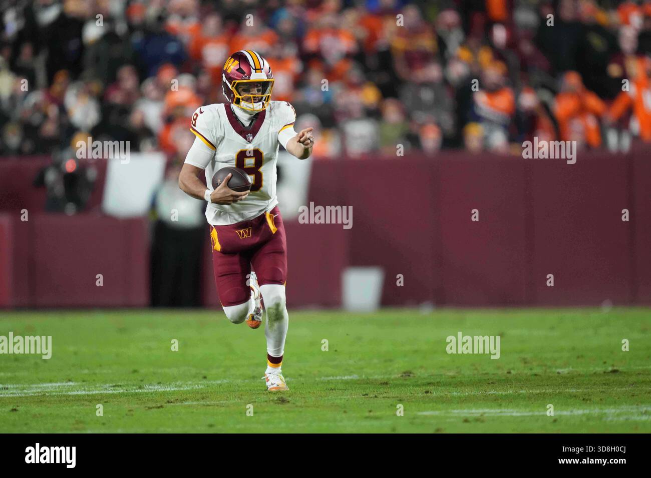 Washington Commanders quarterback Marcus Mariota scrambles during the ...