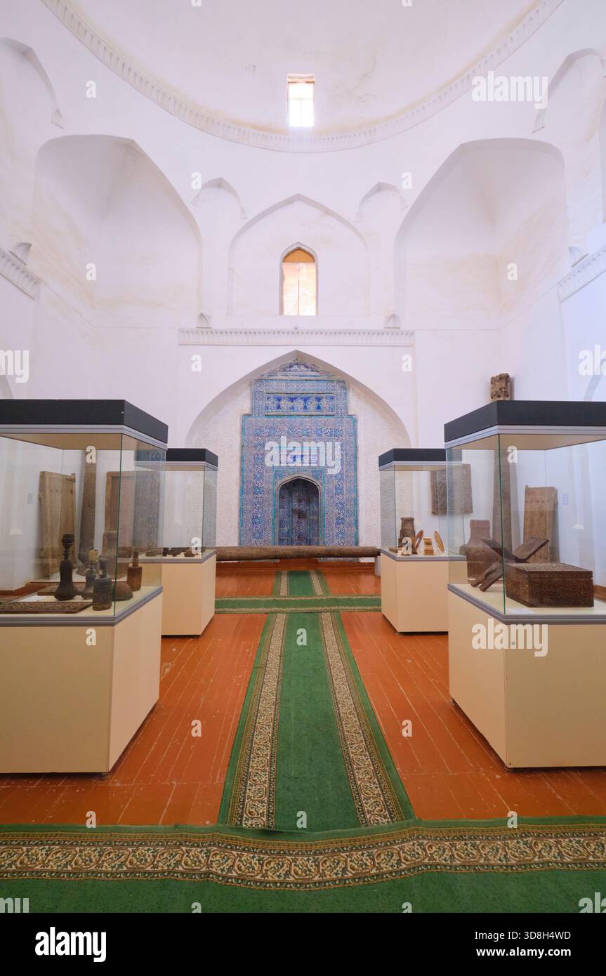 Wood carved items and a blue tile fireplace. In the Museum of Applied ...