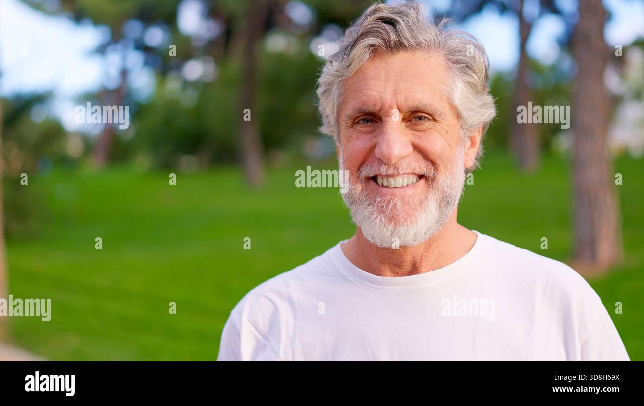 Happy man smiling camera outdoor hi-res stock photography and images ...