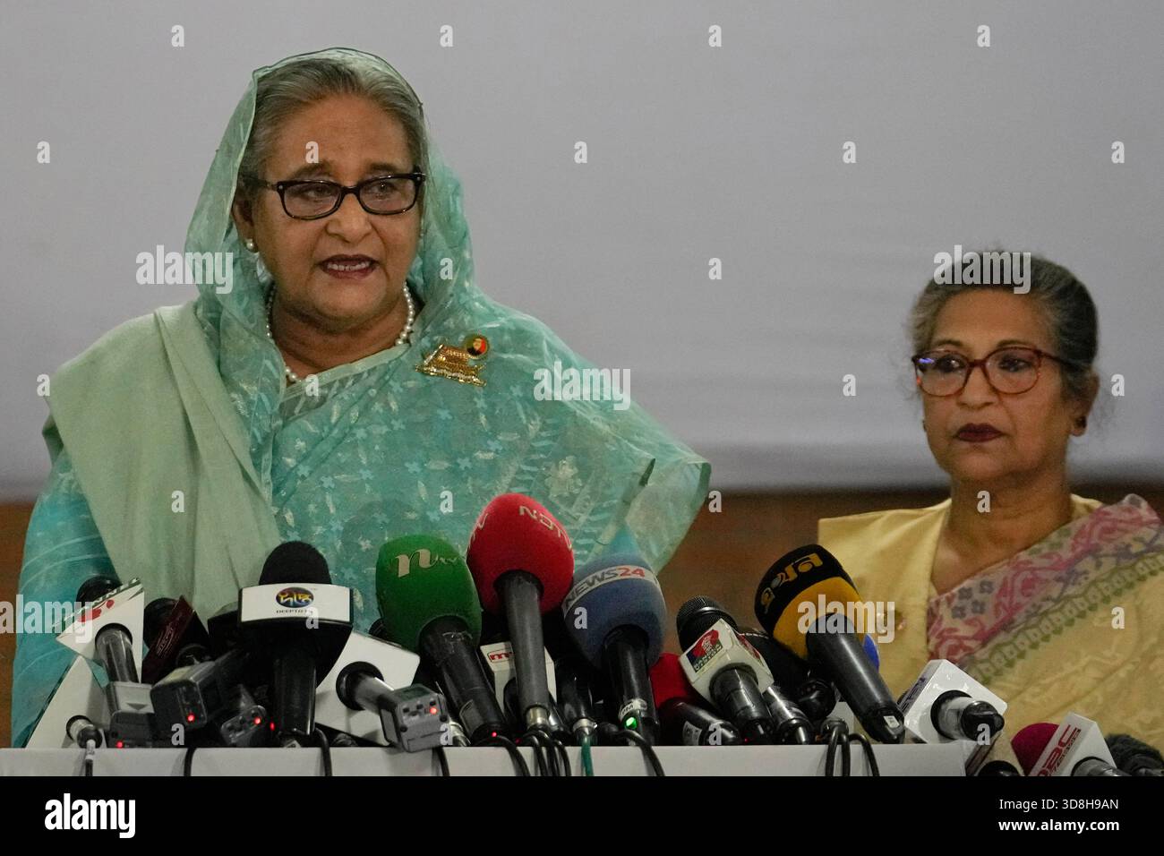 FILE- Bangladesh Prime Minister Sheikh Hasina, left, is flanked by her ...