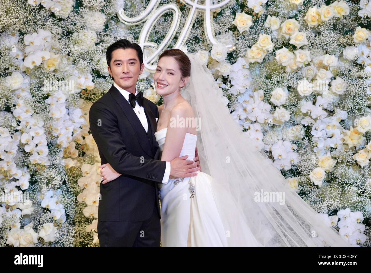 Taiwanese actor, singer and racing driver Roy Chiu and Taiwanese actress Hsu Wei-ning hold a ...