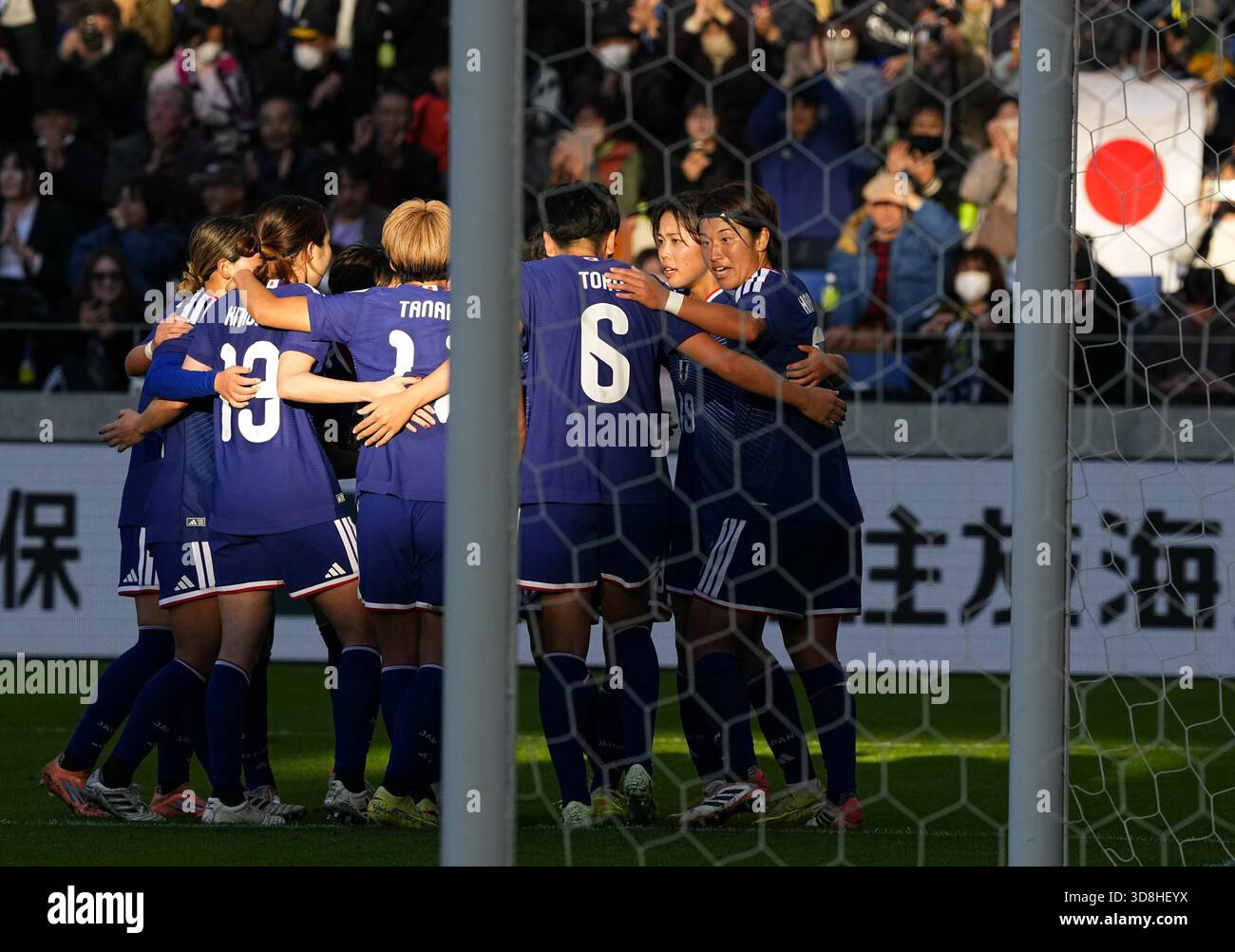 Japan's Momoko Tanikawa (2nd from R) huddles with teammates after ...