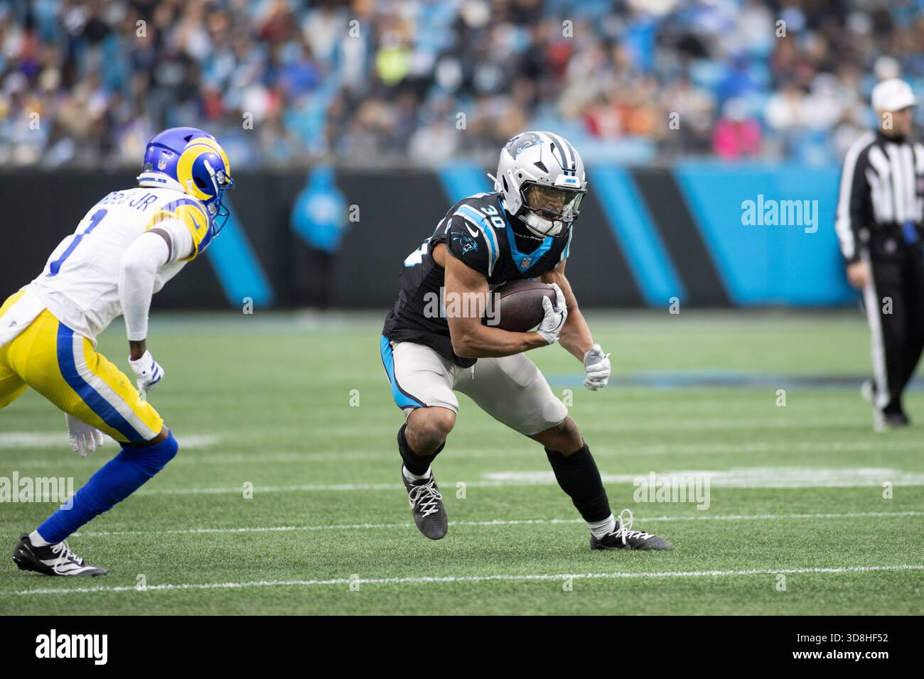 Carolina Panthers running back Chuba Hubbard (30) runs after catching a ...