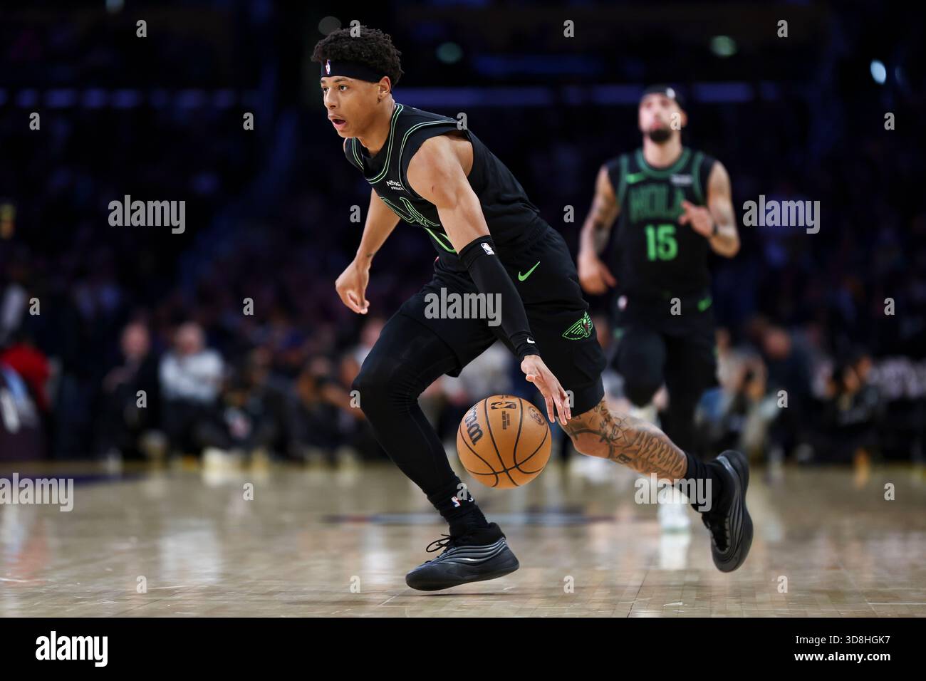 New Orleans Pelicans guard Jeremiah Fears (0) dribbles as guard Jose ...