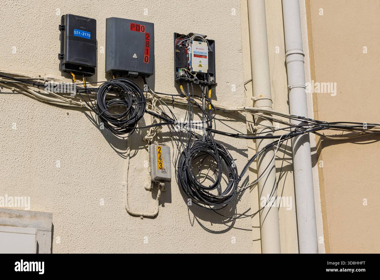 Messy installation of fiber optic (PDO) and communication boxes on an ...
