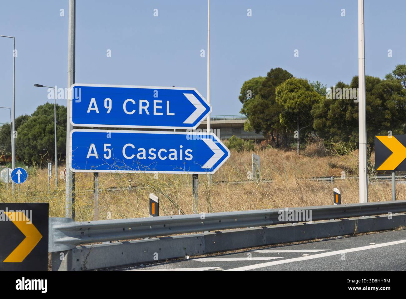 Blue highway direction signs in Portugal pointing to A9 CREL and A5 ...