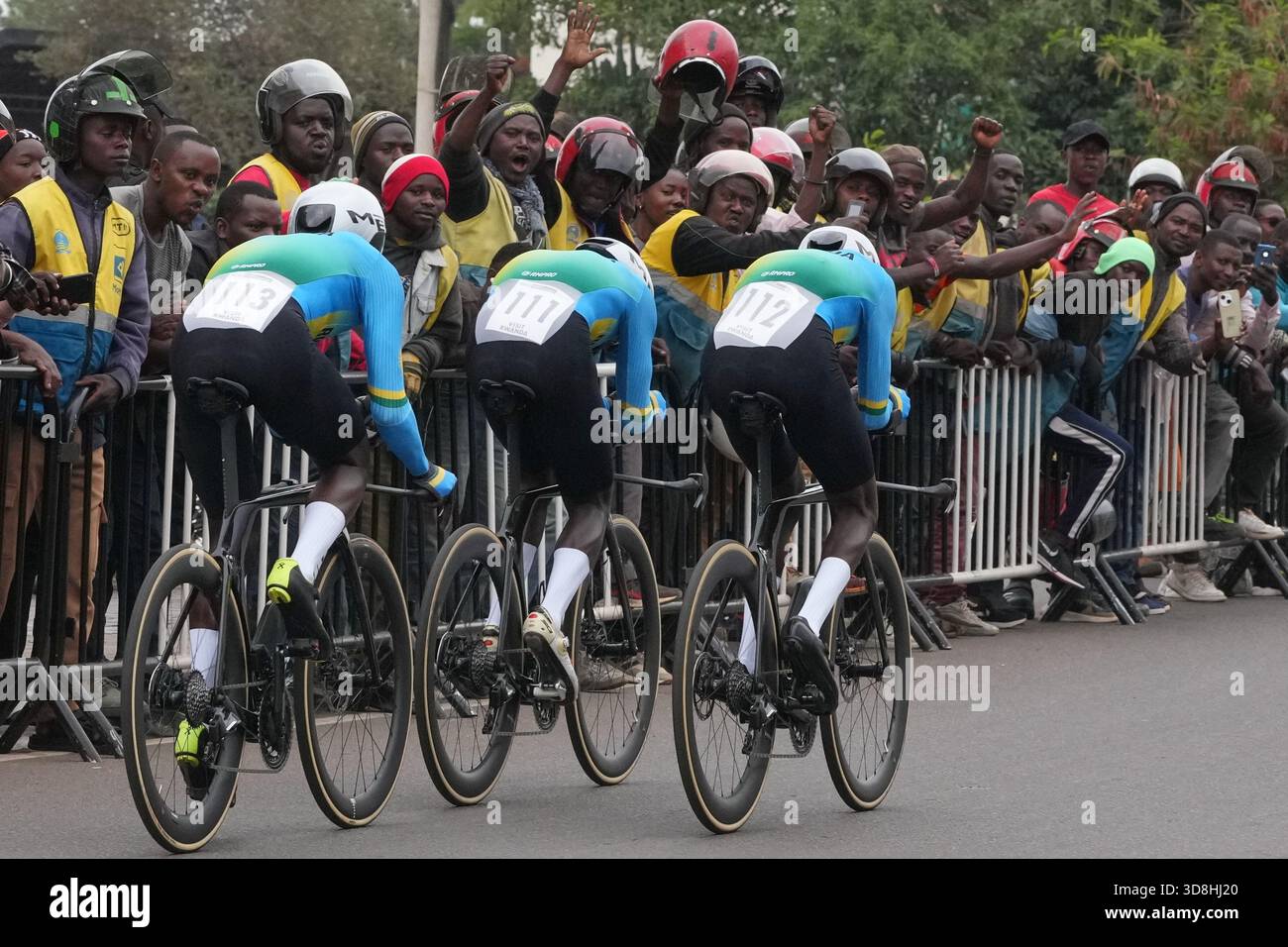 Rwanda's Eric Nkundabera, right, leads teammates Patrick Byukusenge and ...