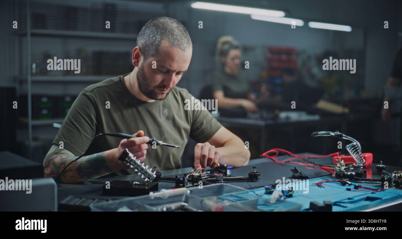 Adult male worker closely soldering hi-res stock photography and images ...