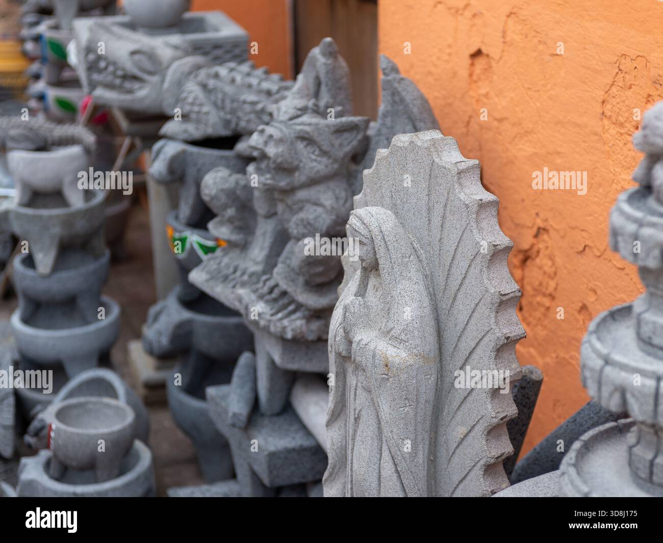 Close Up of Carved Stone Religious Statue and Mortars in Mexican Street ...