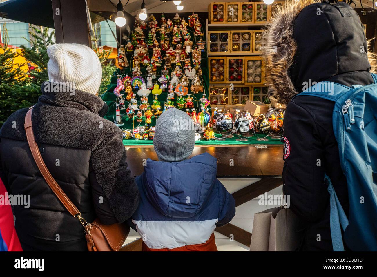 A family looks at what is on offer from one of the many stalls. On the ...