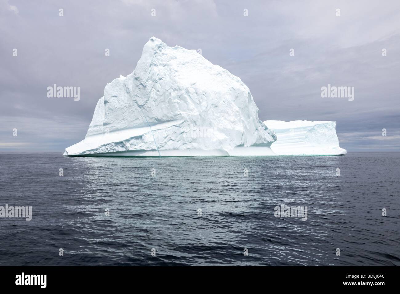 Iceberg Floating in a Calm Sea Stock Photo - Alamy