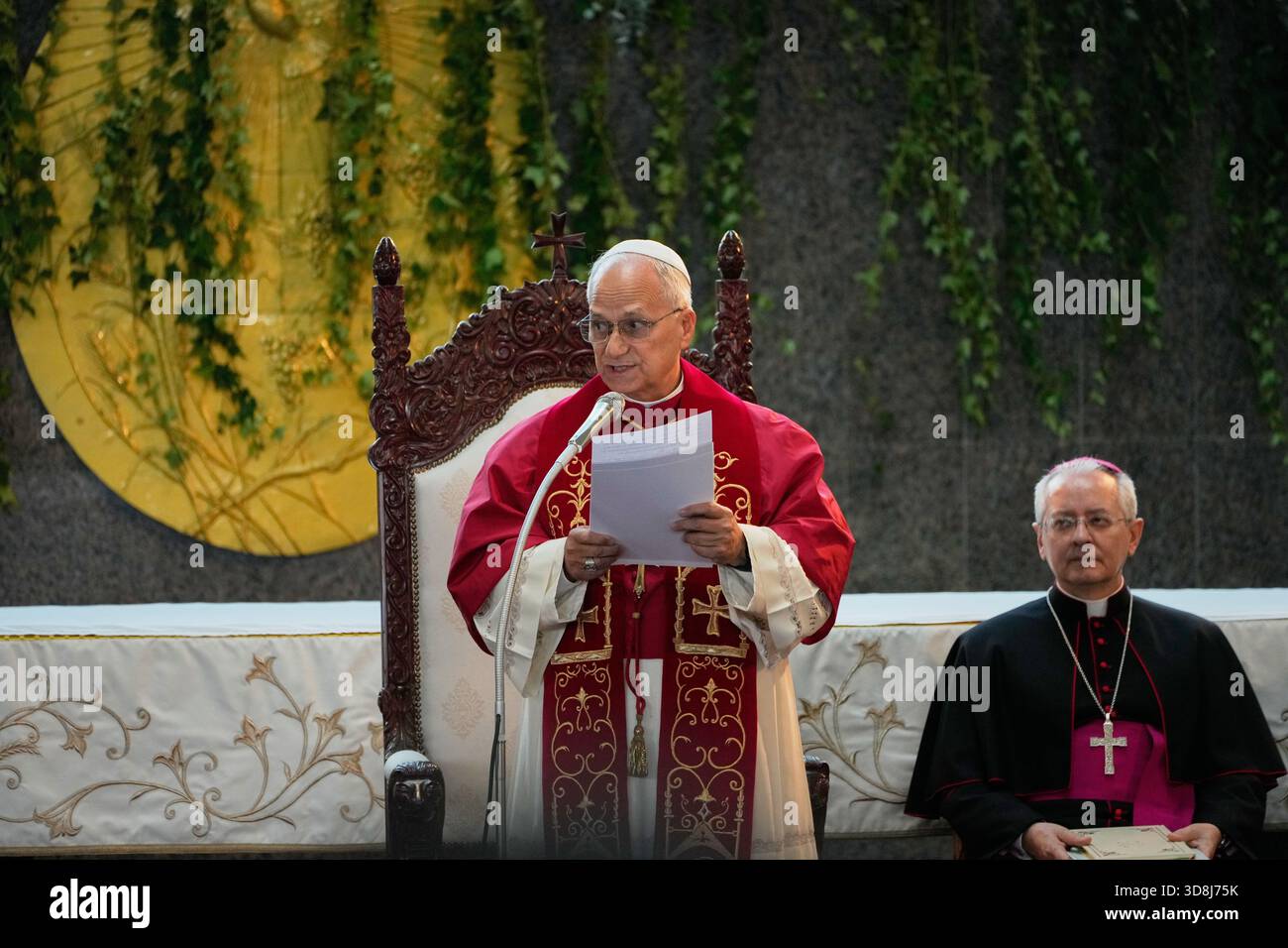 Pope Leo XIV reads his speech at the Catholic basilica of Harissa ...