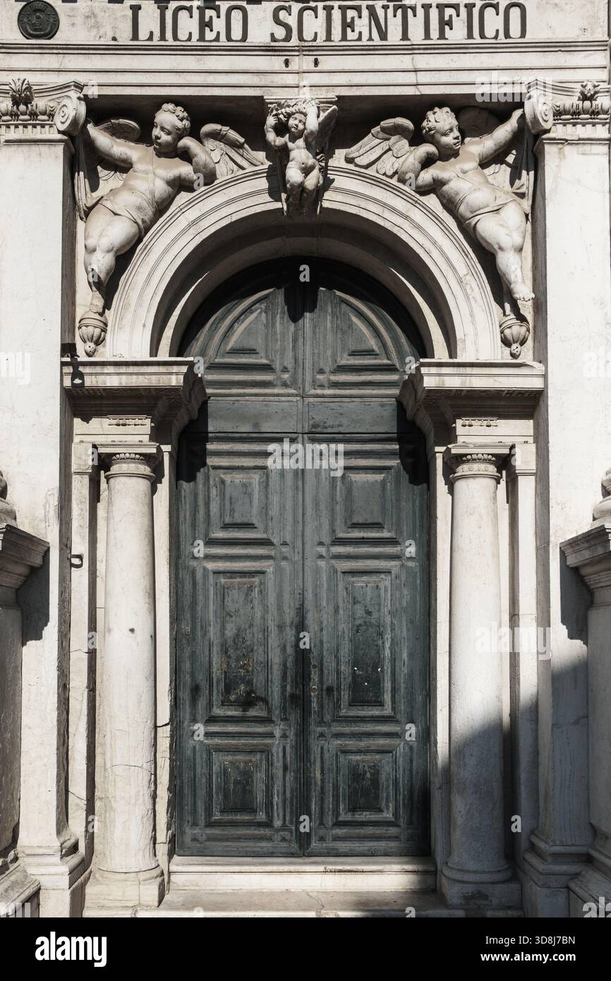 Ornate stone doorway and statues on the facade of the Liceo Scientifico ...