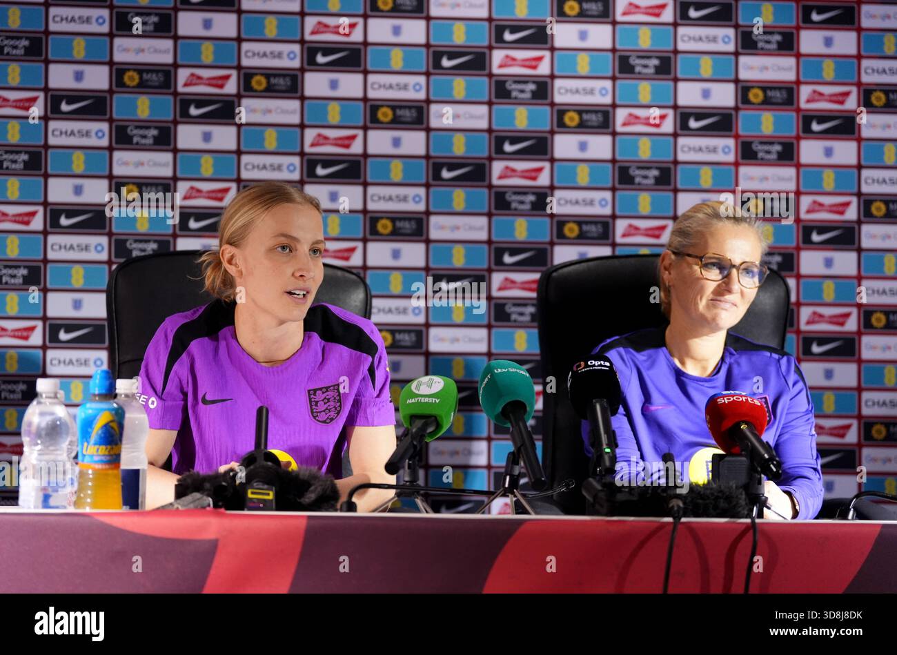England manager Sarina Wiegman and Aggie Beaver-Jones (left) during a ...