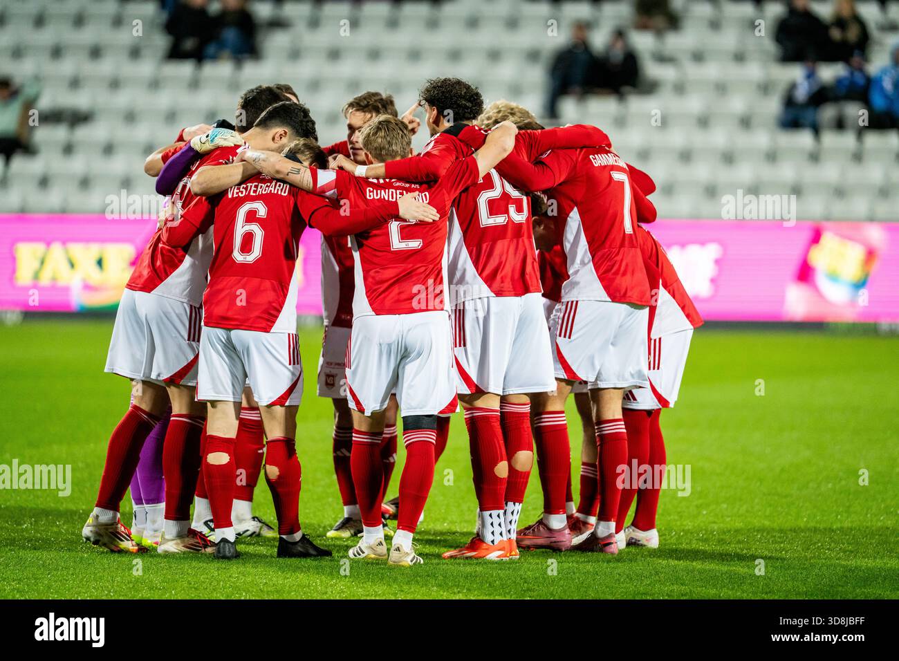 Odense, Denmark. 30th, November 2025. The players of Vejle BK unite in ...