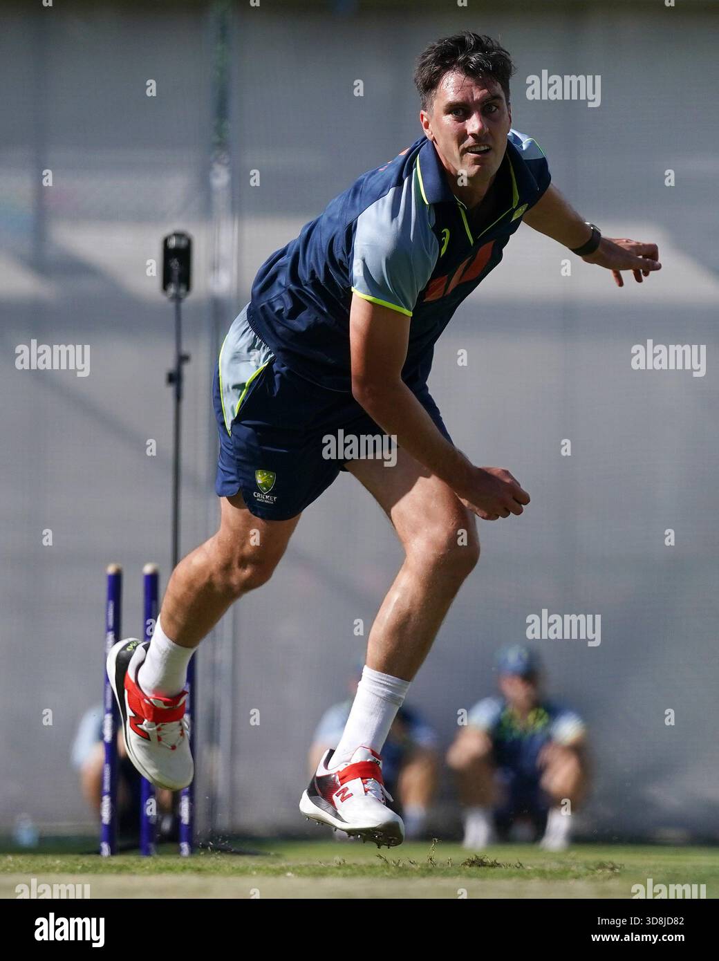 Australia's Pat Cummins bowls during a nets session at The Gabba ...