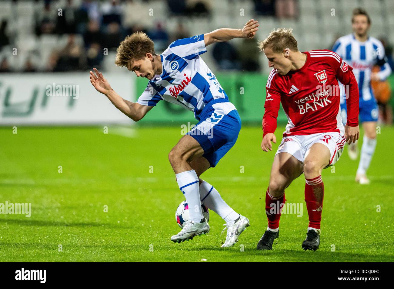 Odense, Denmark. 30th, November 2025. Max Ejdum (L) of Odense BK and ...