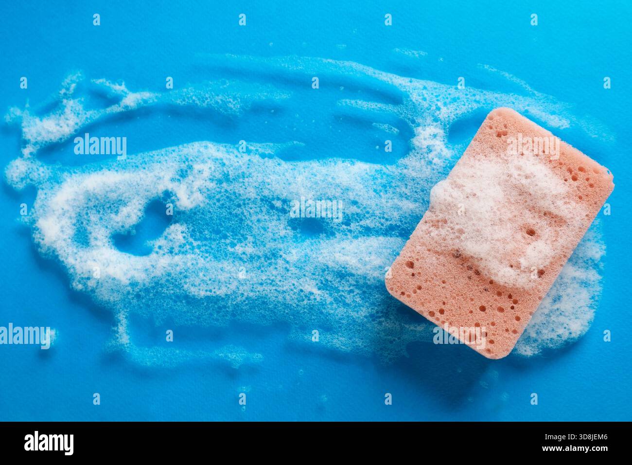 Kitchen sponge with foam on light blue background, top view Stock Photo ...