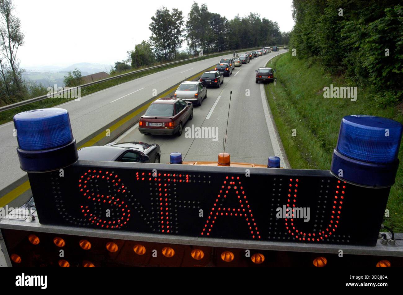 a traffic congestion warning road sign standing on the street traffic ...