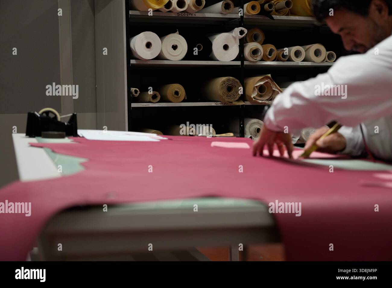 A leather good operator works at the Prada factory in Scandicci, Italy ...