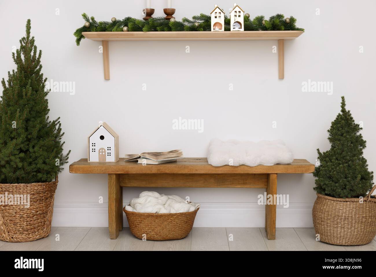 Stylish room with small spruce trees and Christmas decor. Interior ...