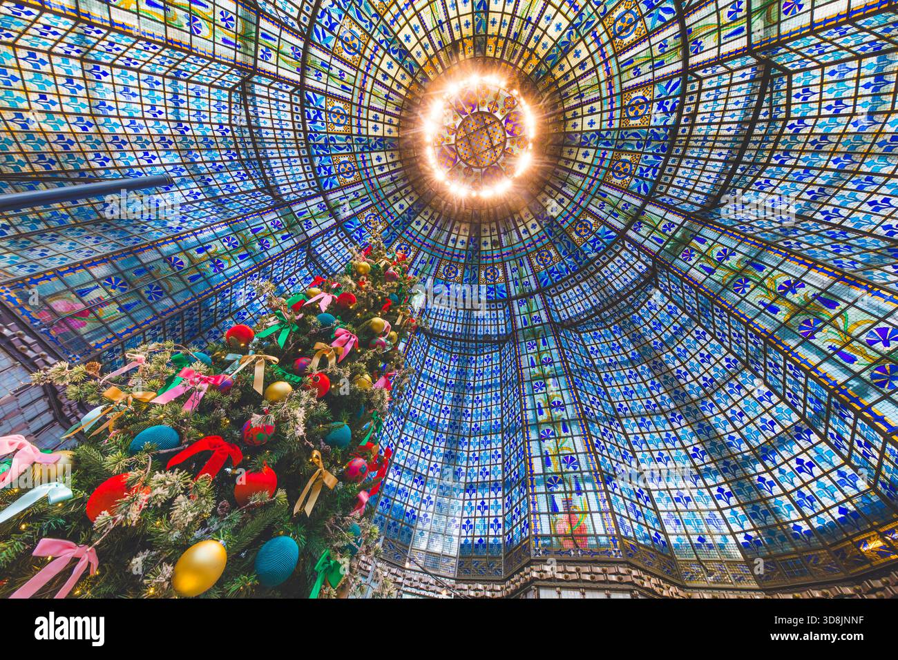 France, ile-de-France, Paris. The fir tree under the dome of Printemps ...