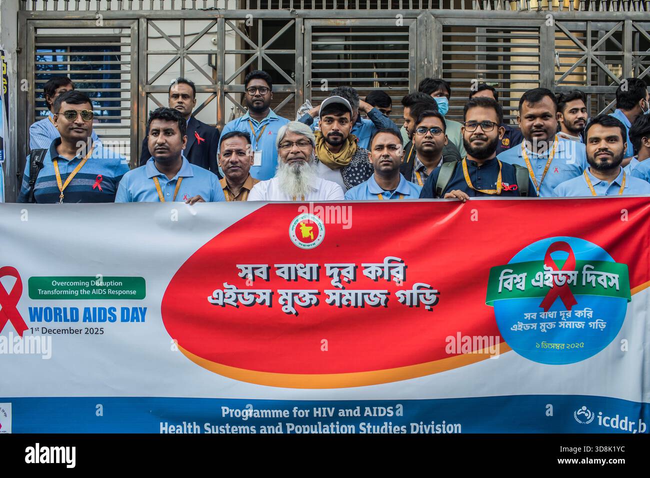 Participants and workers from various organizations hold a banner and ...