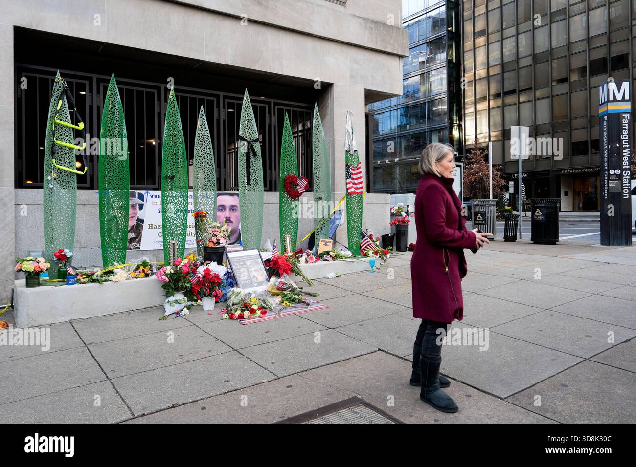 A reporter does a stand-up in front of a makeshift memorial for U.S ...