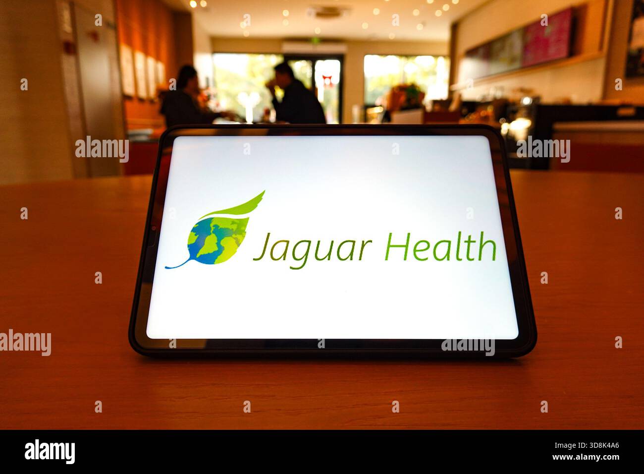 In this photo illustration, the Jaguar Health logo is seen displayed on ...