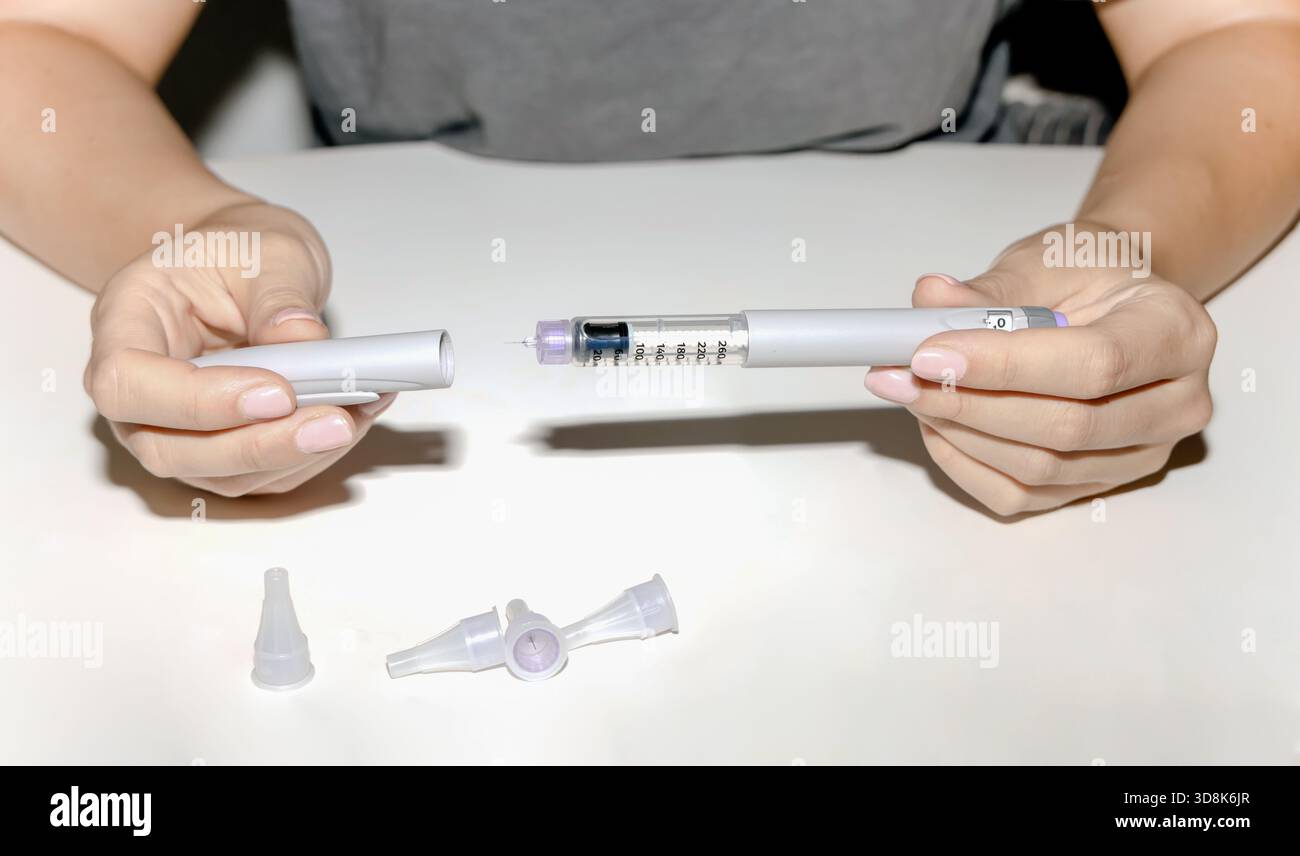 Female hands holding an insulin pen. Ozempic Insulin injection pen or ...
