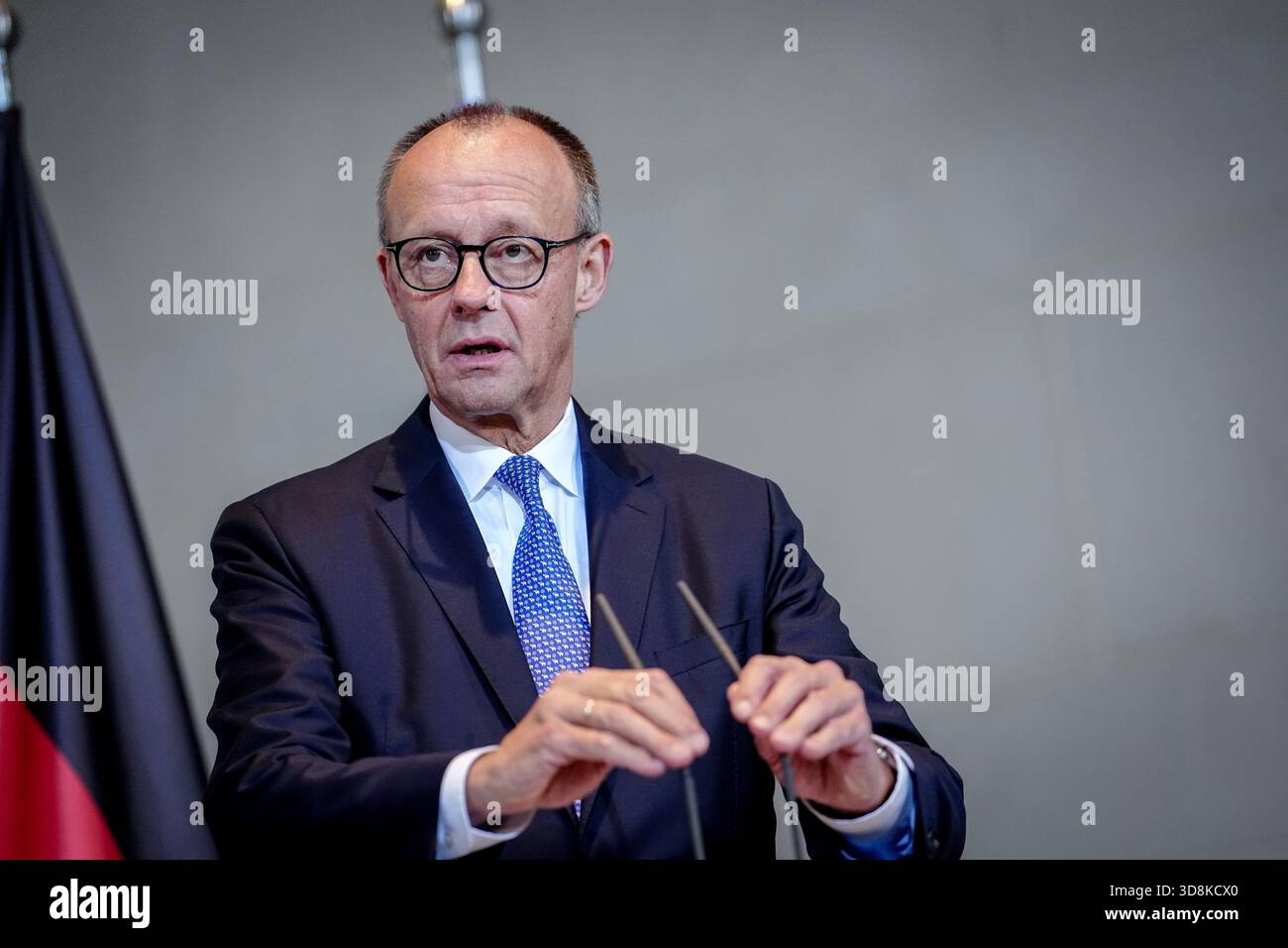 01 December 2025, Berlin: Federal Chancellor Friedrich Merz (CDU) gives ...