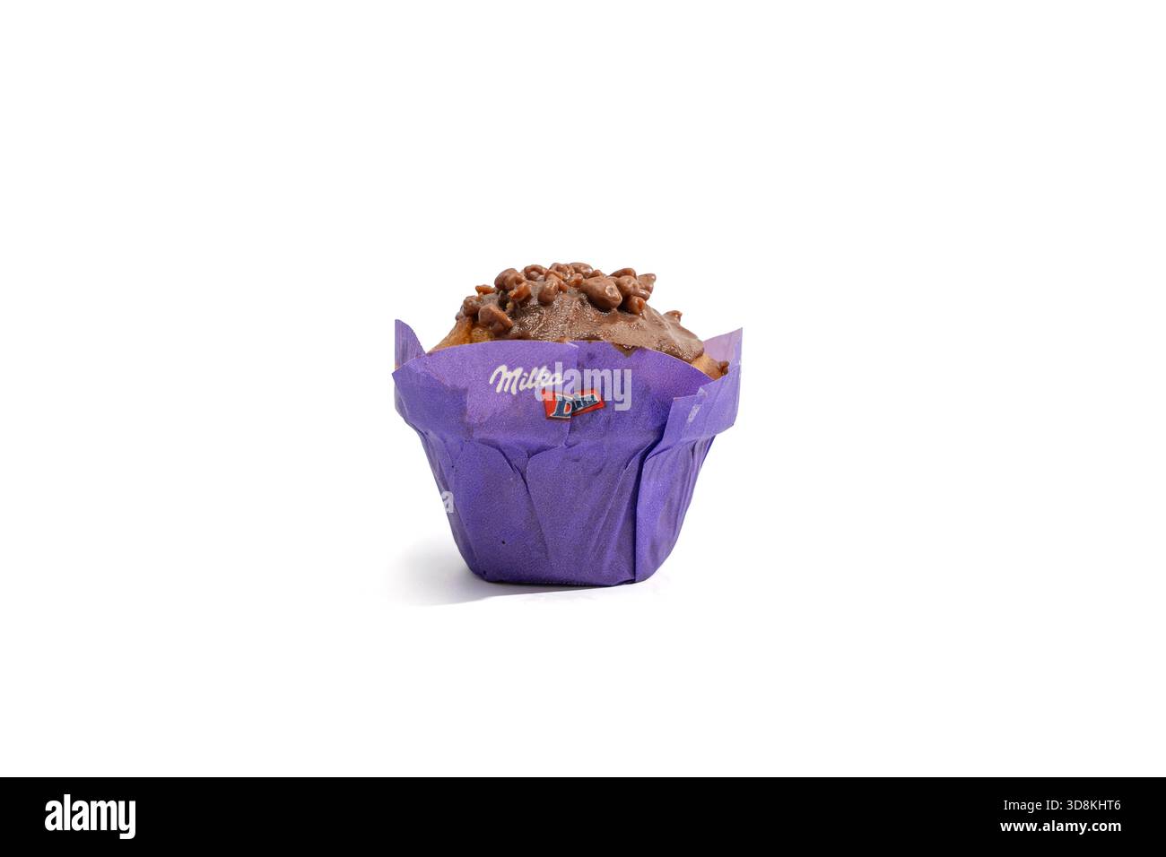 Germany Berlin November 30, 2025. Single Milka Daim muffin in a purple ...