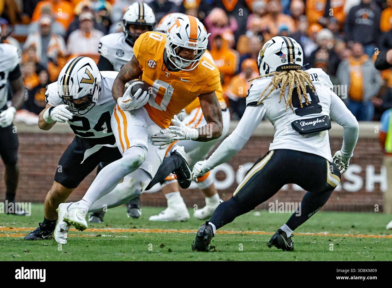Tennessee tight end Ethan Davis (0) runs for yardage as he's hit by ...