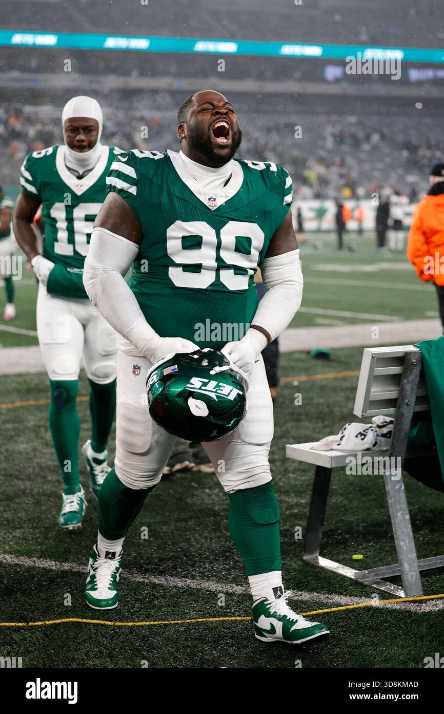 New York Jets defensive lineman Khalen Saunders Sr. (99) heads into the ...