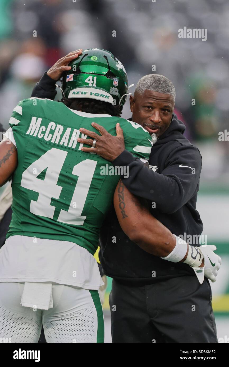 New York Jets head coach Aaron Glenn hugs linebacker Marcelino McCrary ...