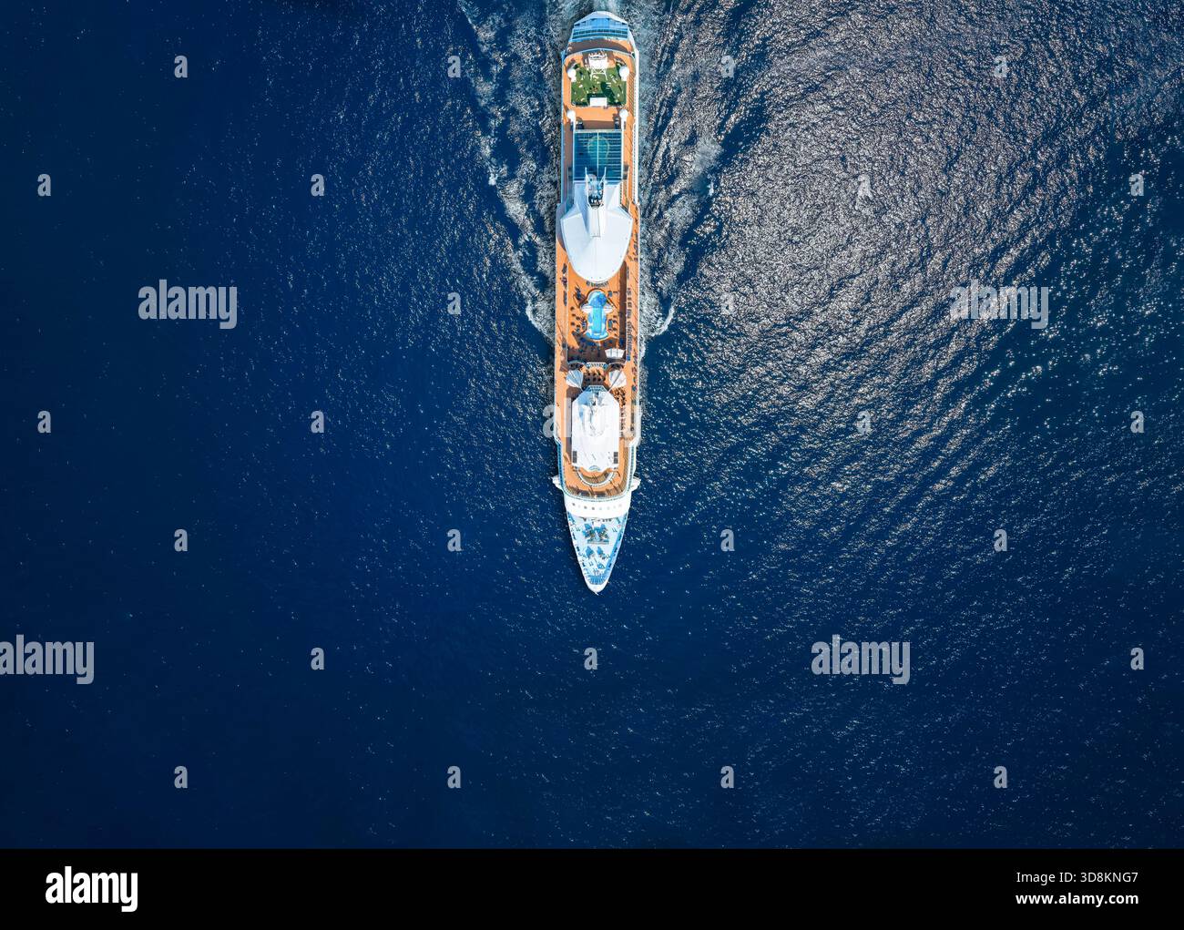 Aerial overhead view of a generic cruise ship sailing over sparkling ...