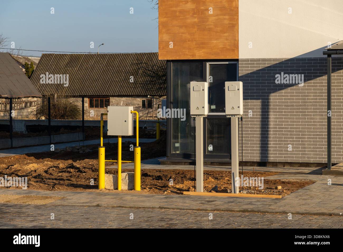 Exterior view of a newly built house with outdoor utility meters and ...