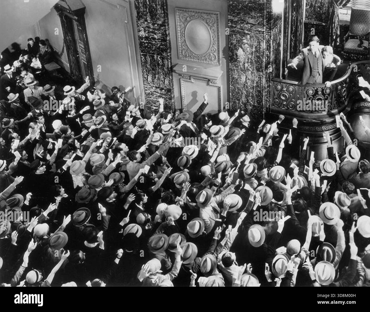 Bank president Walter Huston faces a crowd of frantic depositors in the ...