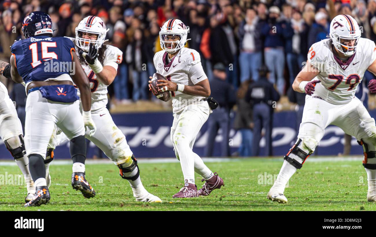 Virginia Tech Hokies quarterback Kyron Drones (1) looks to pass the ...