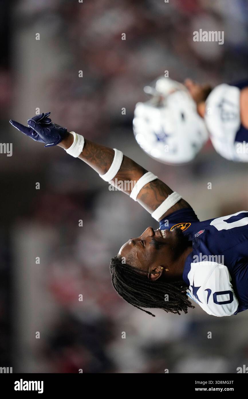 Philadelphia Eagles quarterback Sam Howell warms up before an NFL football game against the ...