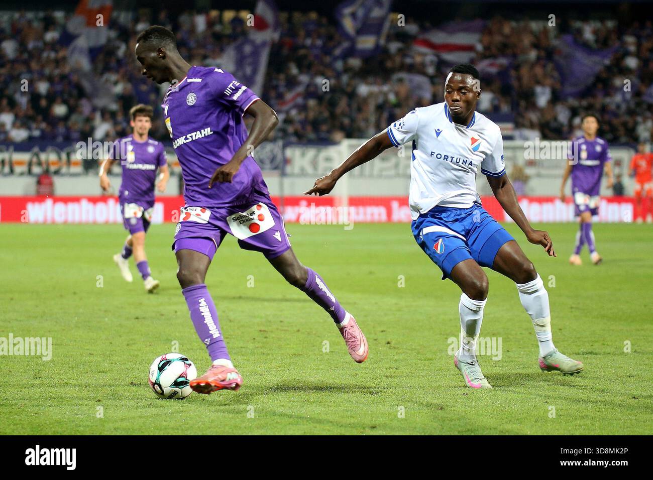 VIENNA, AUSTRIA - AUGUST 14: Abubakr Barry of Austria Wien and Patrick ...