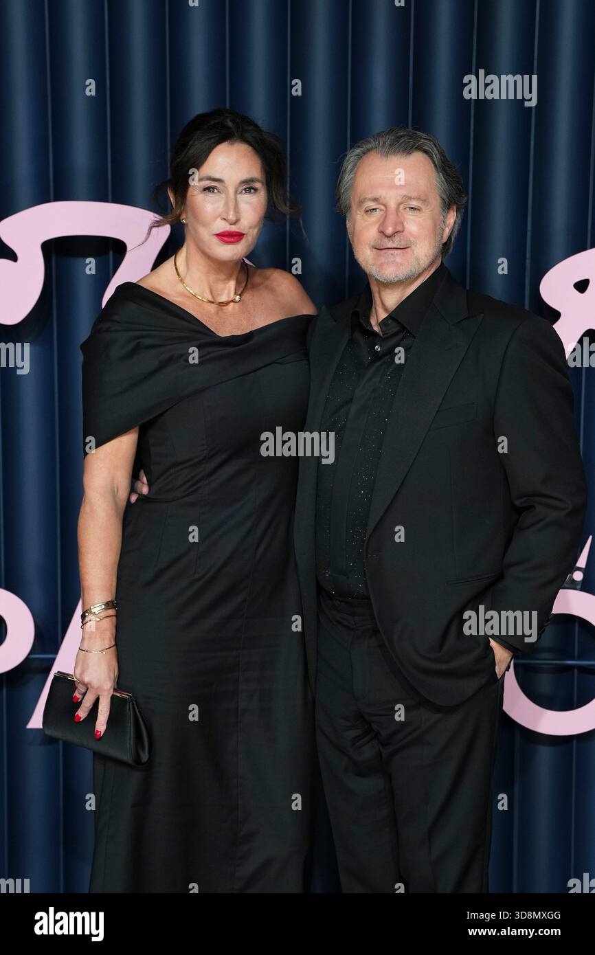 Maria Lacik and Alexander Lacik pose for photographers upon arrival at ...
