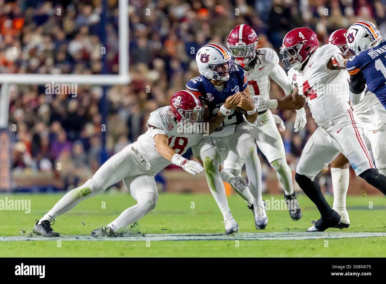 Alabama defensive back Bray Hubbard (18) hits Auburn quarterback Ashton ...