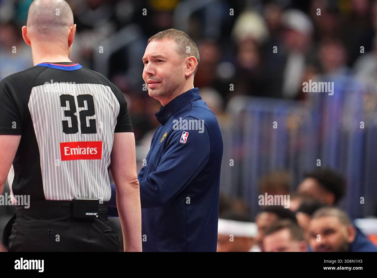 Denver Nuggets head coach David Adelman confers with referee Marat ...