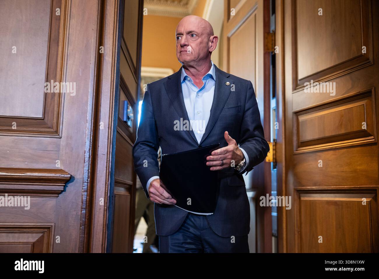 Sen. Mark Kelly (D-Ariz.) arrives for a press conference at the U.S ...