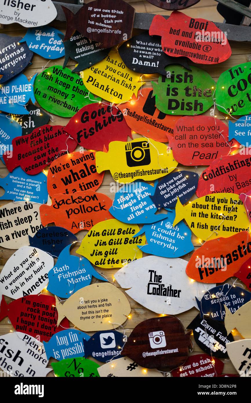 A collection of fish-shaped signs with various fishing puns and jokes ...